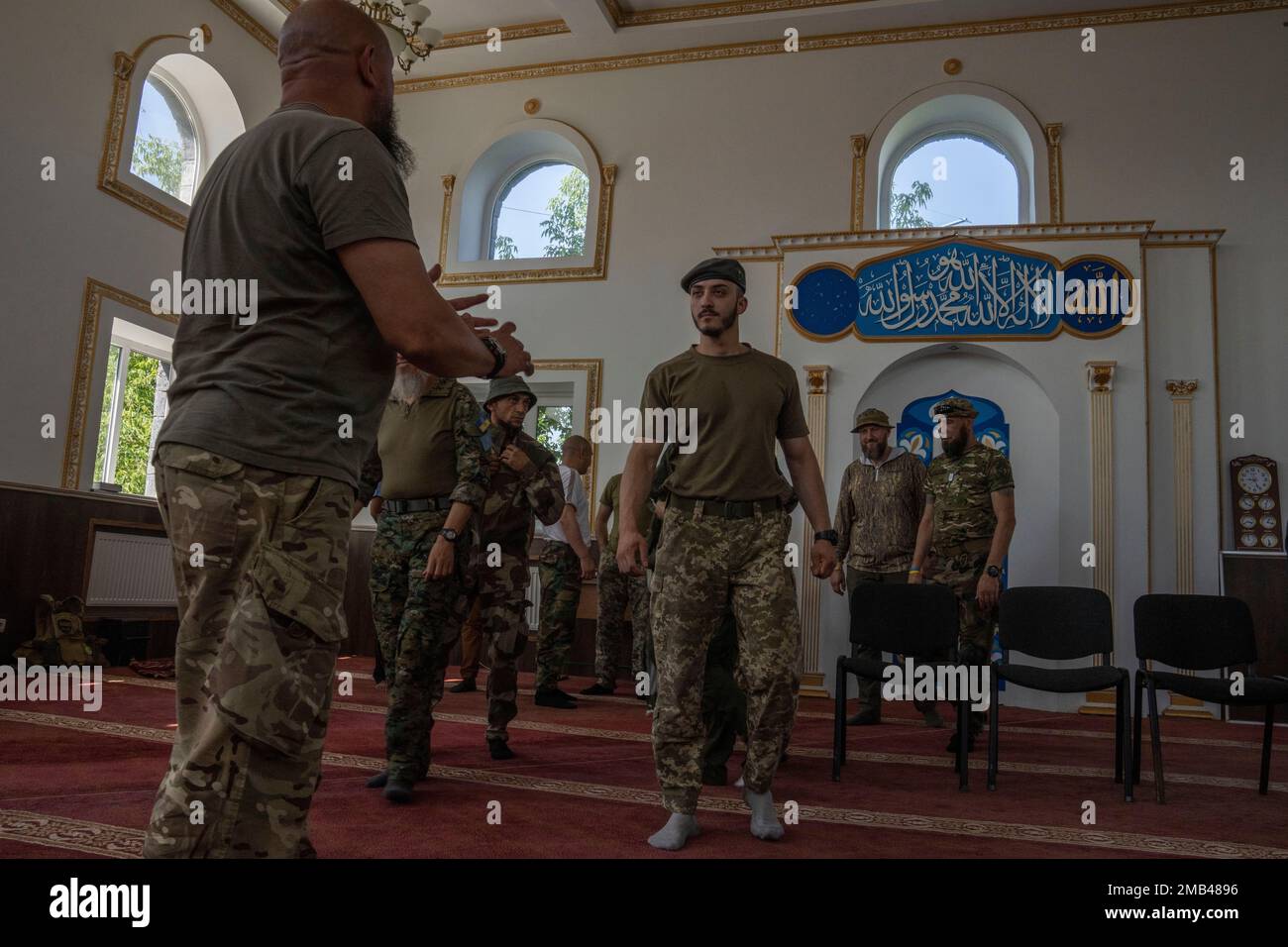 Ukrainian Muslim soldiers talk after prayers on the first day of Eid al ...