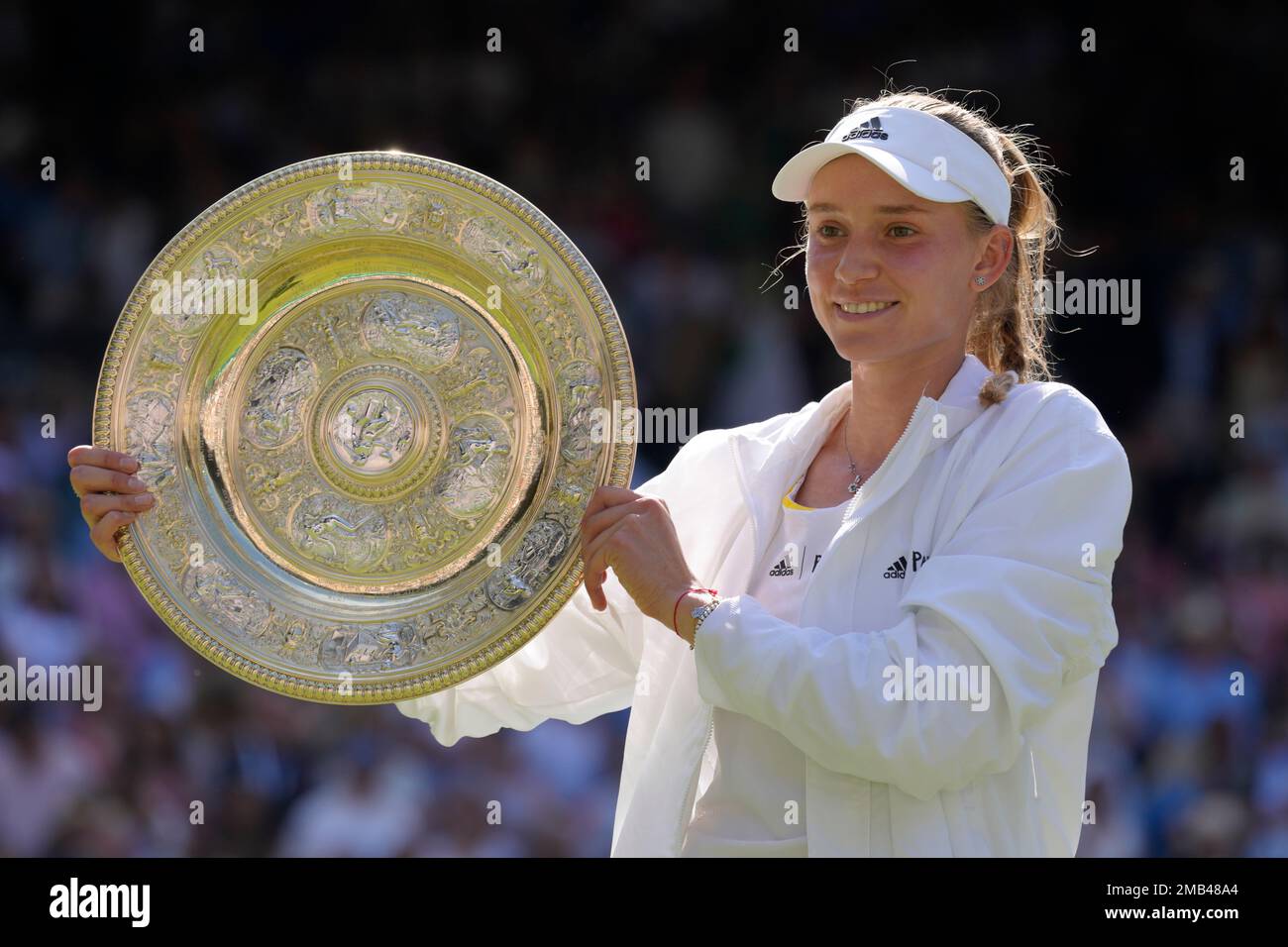 Kazakhstan's Elena Rybakina holds the trophy as she celebrates after ...