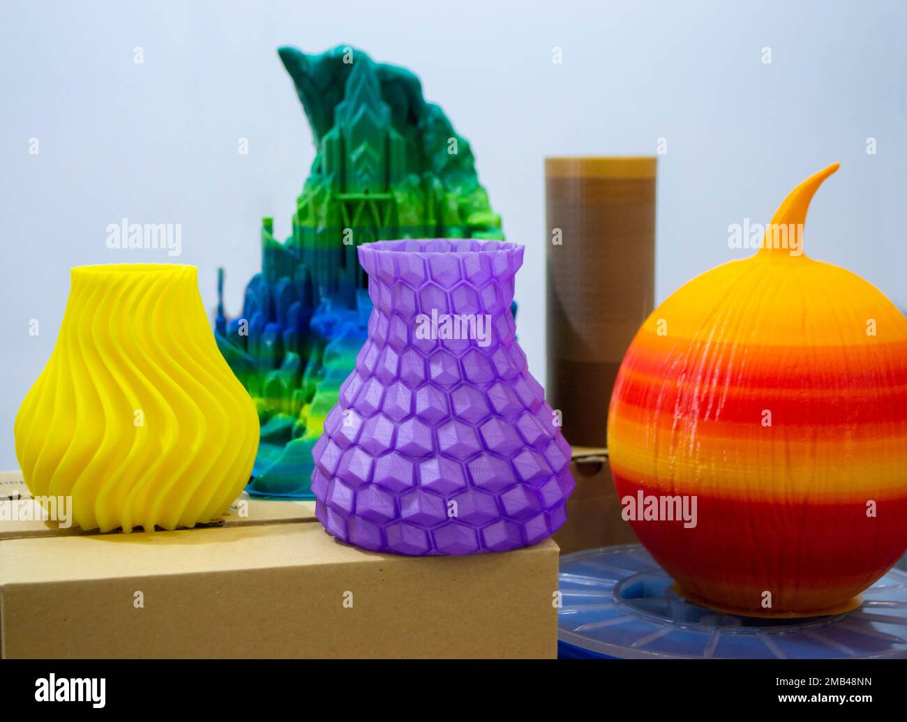 Several different abstract multi-color models printed on a 3D printer ...
