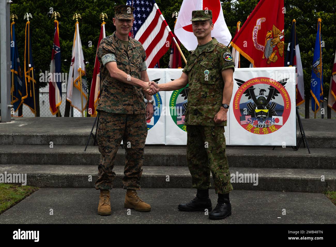 U.S. Marine Corps Col. Neil Owens (left), commanding officer of ...