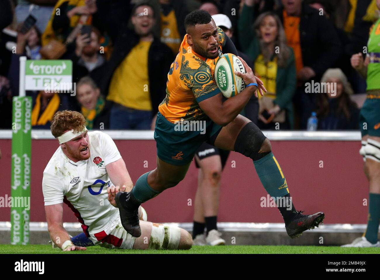 Australia's Samu Kerevi, right, gets past England's Ollie Chessum on ...