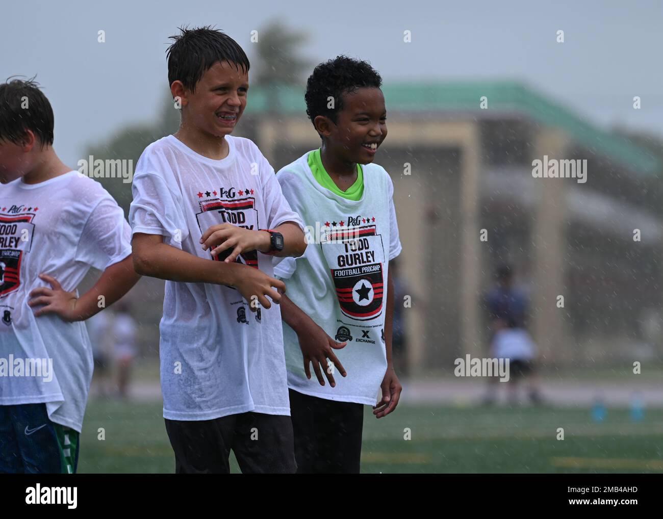 Children laugh together during a Football ProCamp on Andersen Air Force ...