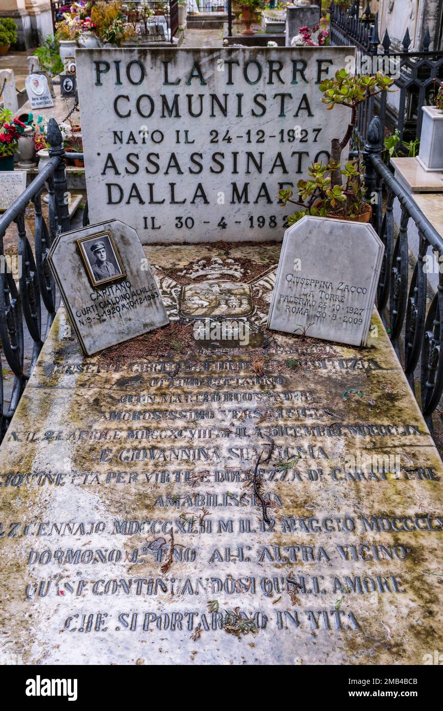 Graves of mafia victims, sculptures, photos and flowers in the cemetery ...