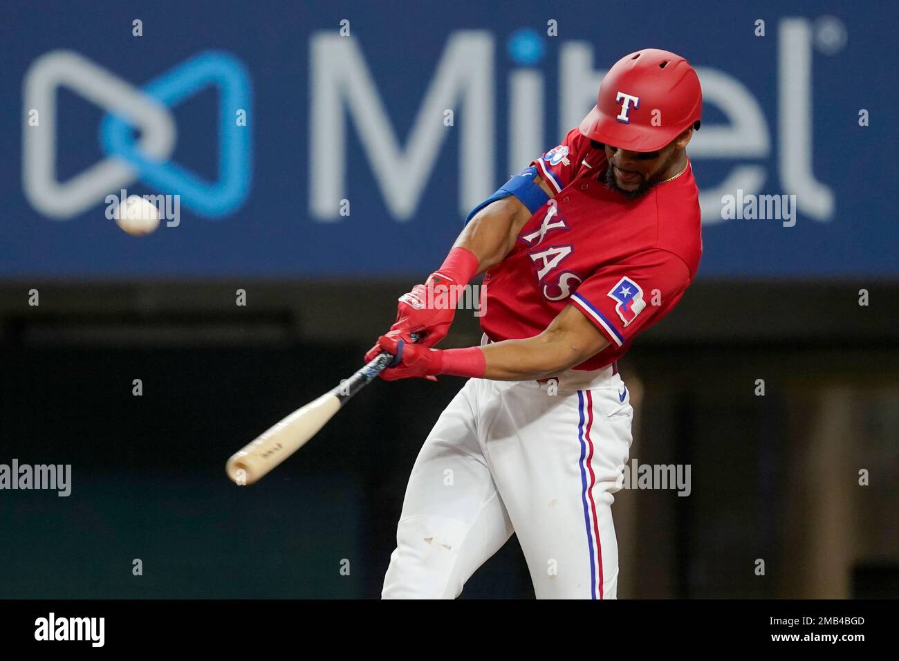 Texas Rangers' Leody Taveras follows through on a sacrifice fly that ...