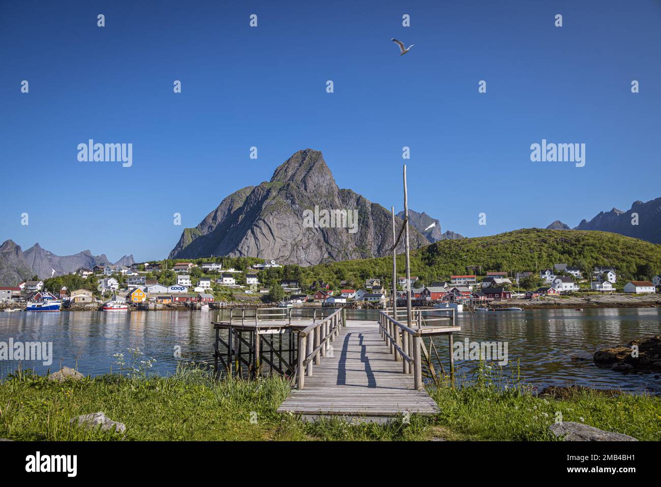 Mountain and boats in the harbour, Reine, Moskenesoya, Lofoten Islands ...