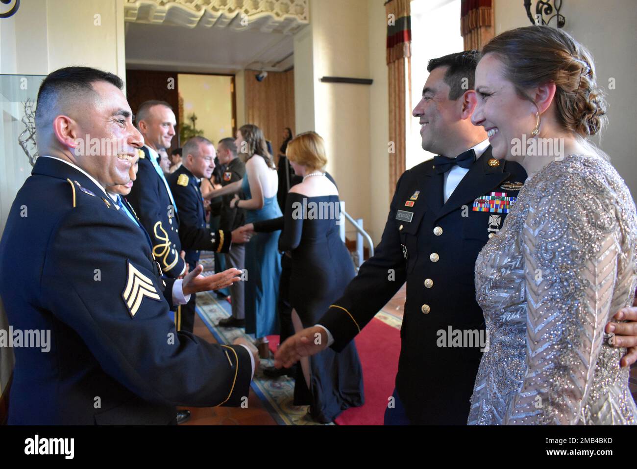 Members of the receiving line greet guests at the 229th Military ...