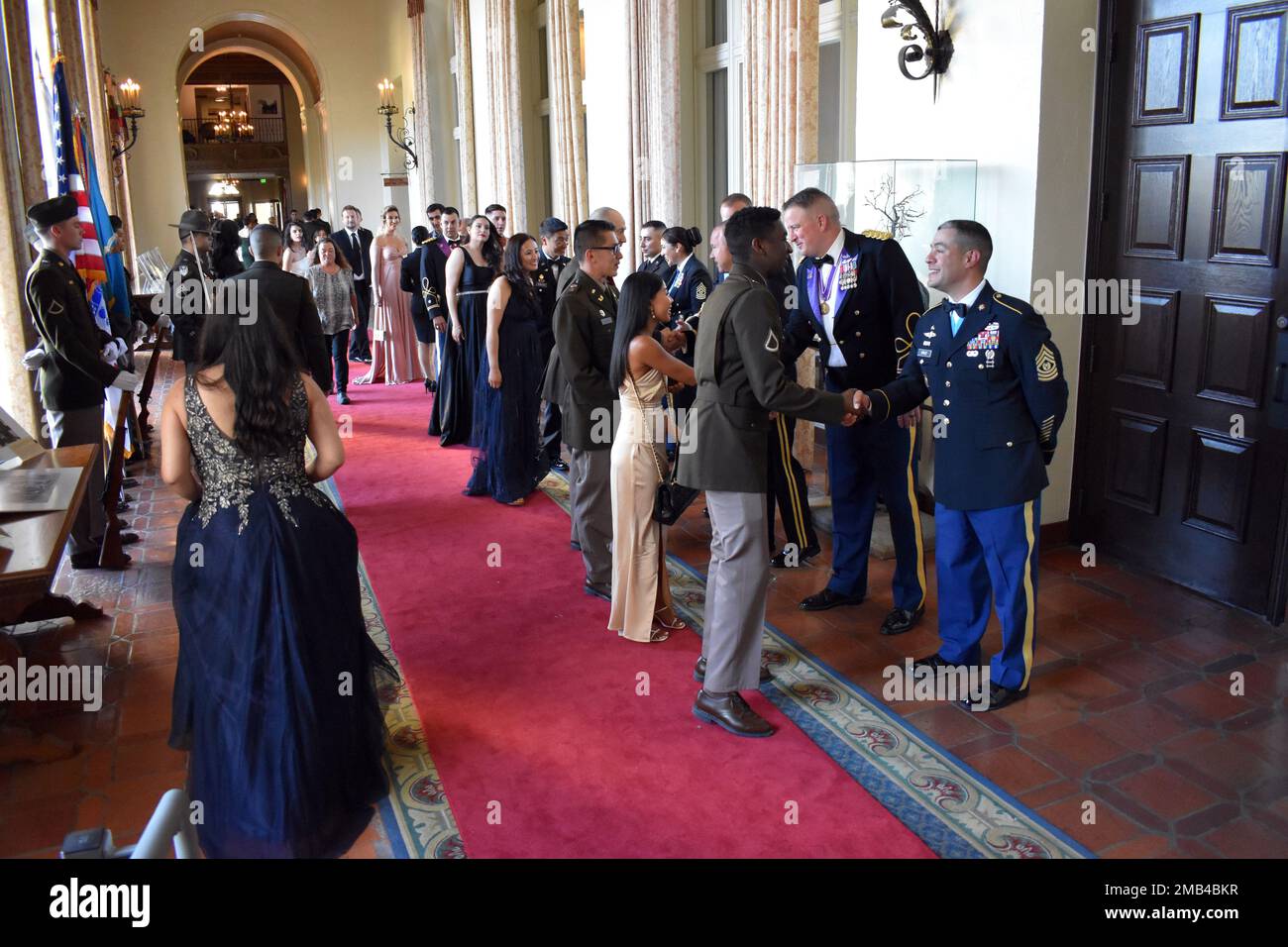Members of the receiving line greet guests at the 229th Military ...