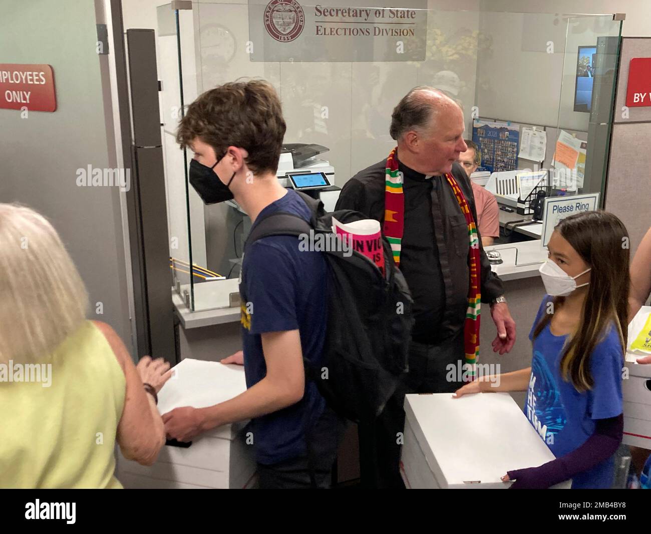Children deliver boxes with the signature sheets to the Oregon ...