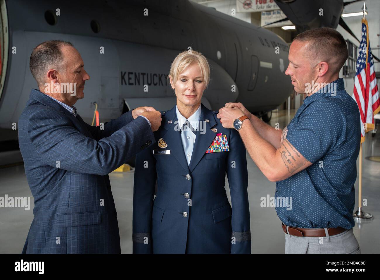 Family members pin brigadier general’s officer rank to the uniform of ...
