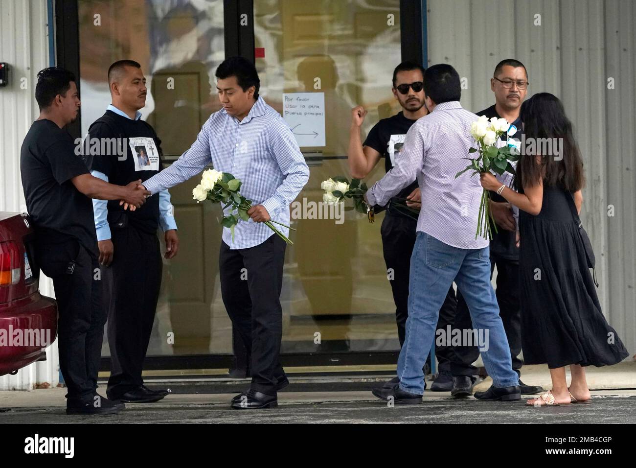 Family members are greeted at a private viewing and funeral service for ...