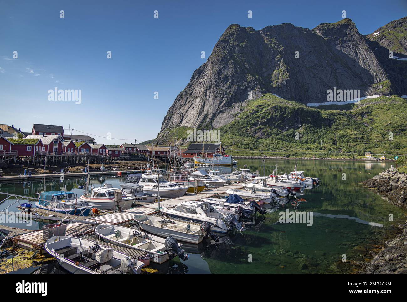 Mountain and boats in the harbour, Reine, Moskenesoya, Lofoten Islands ...