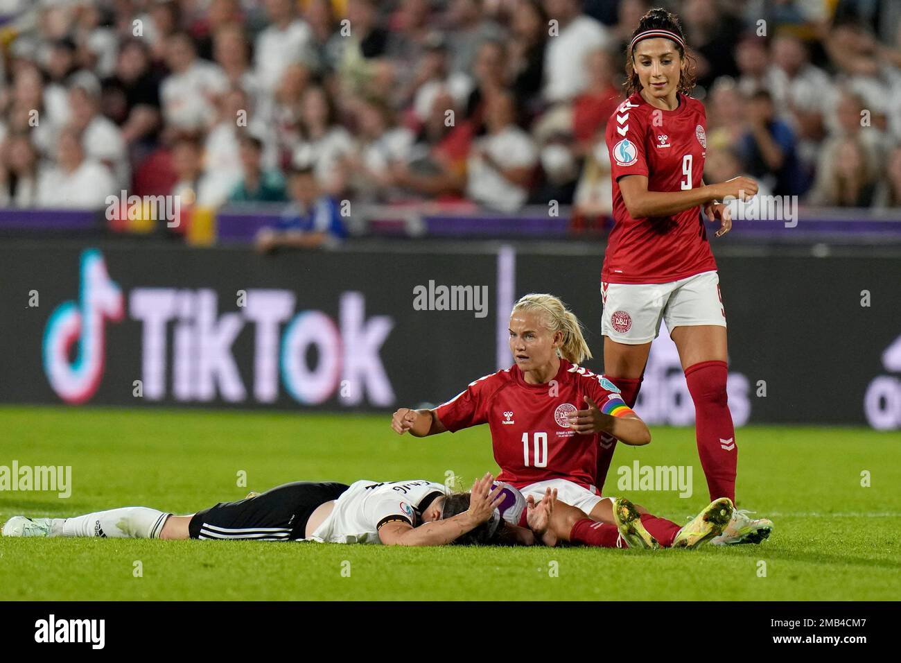 Denmark's Nadia Nadim, right, looks at teammate Pernille Harder and ...