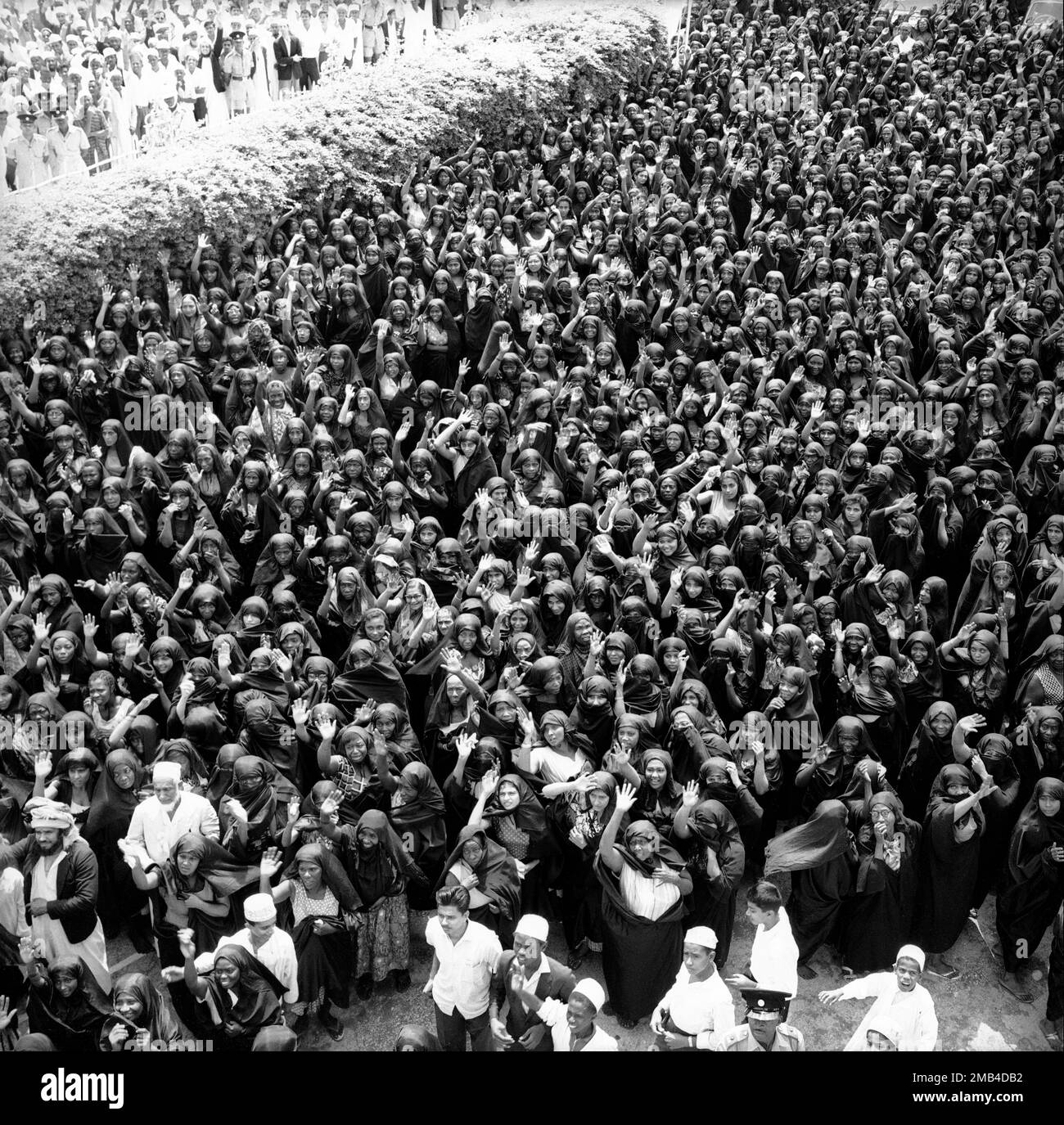Women cheer outside the royal palace in Zanzibar, Tanzania as Seyyid ...