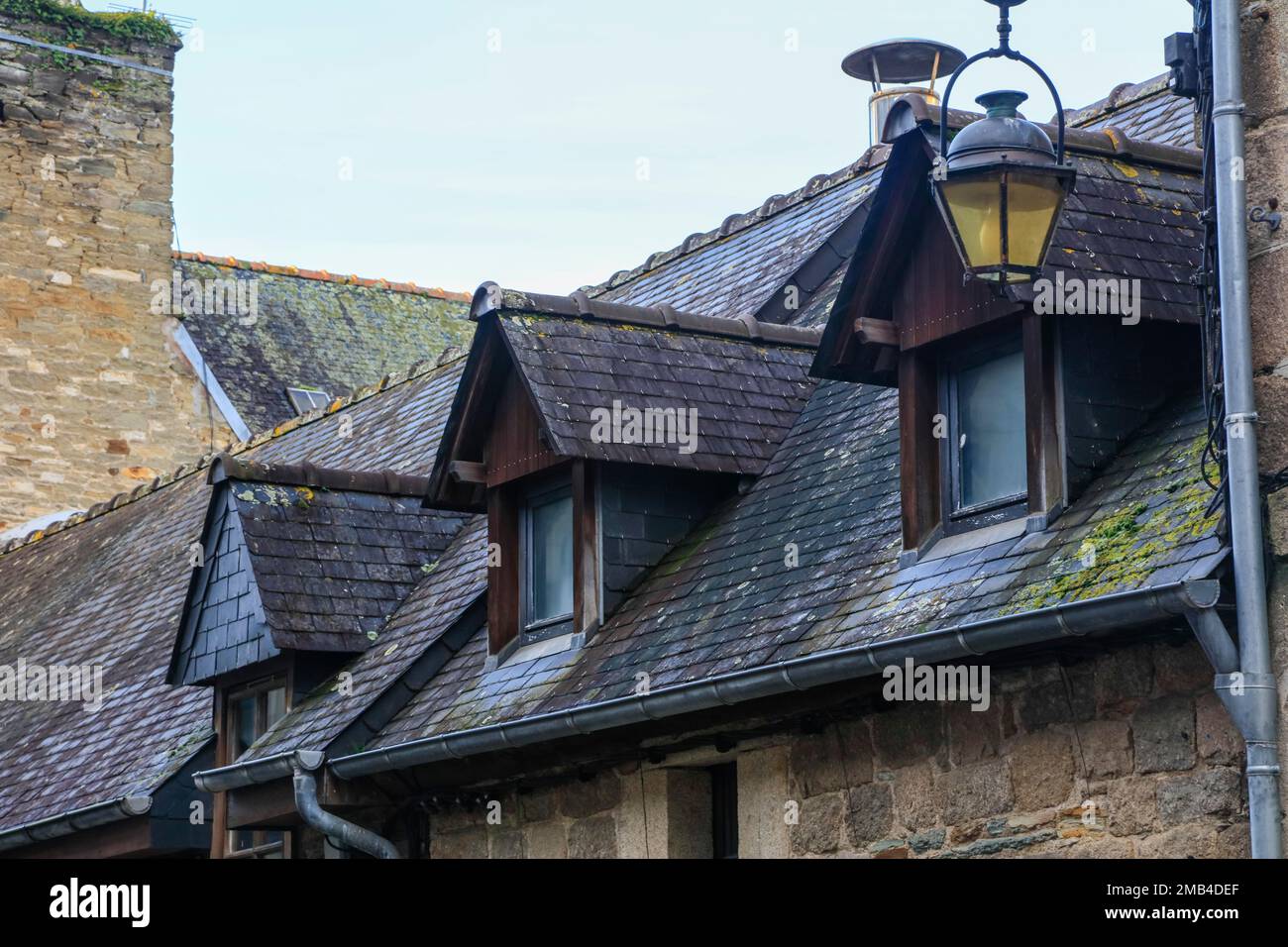 Dormer windows in the slate roof of a stone house, old town of Lannion ...