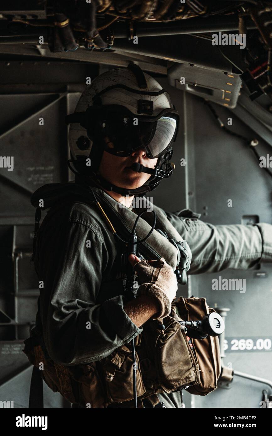 U.S. Marine Corps Cpl. Ryan Caffrey, an MV-22B Osprey crew chief with ...