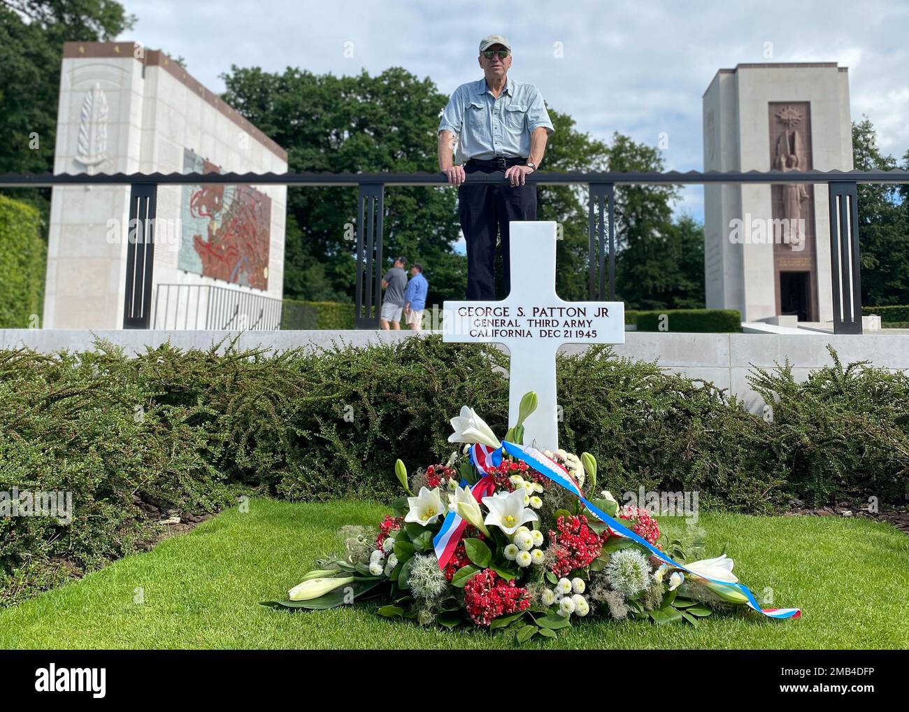 A visitor views the cemetery behind the gravesite of General George S ...