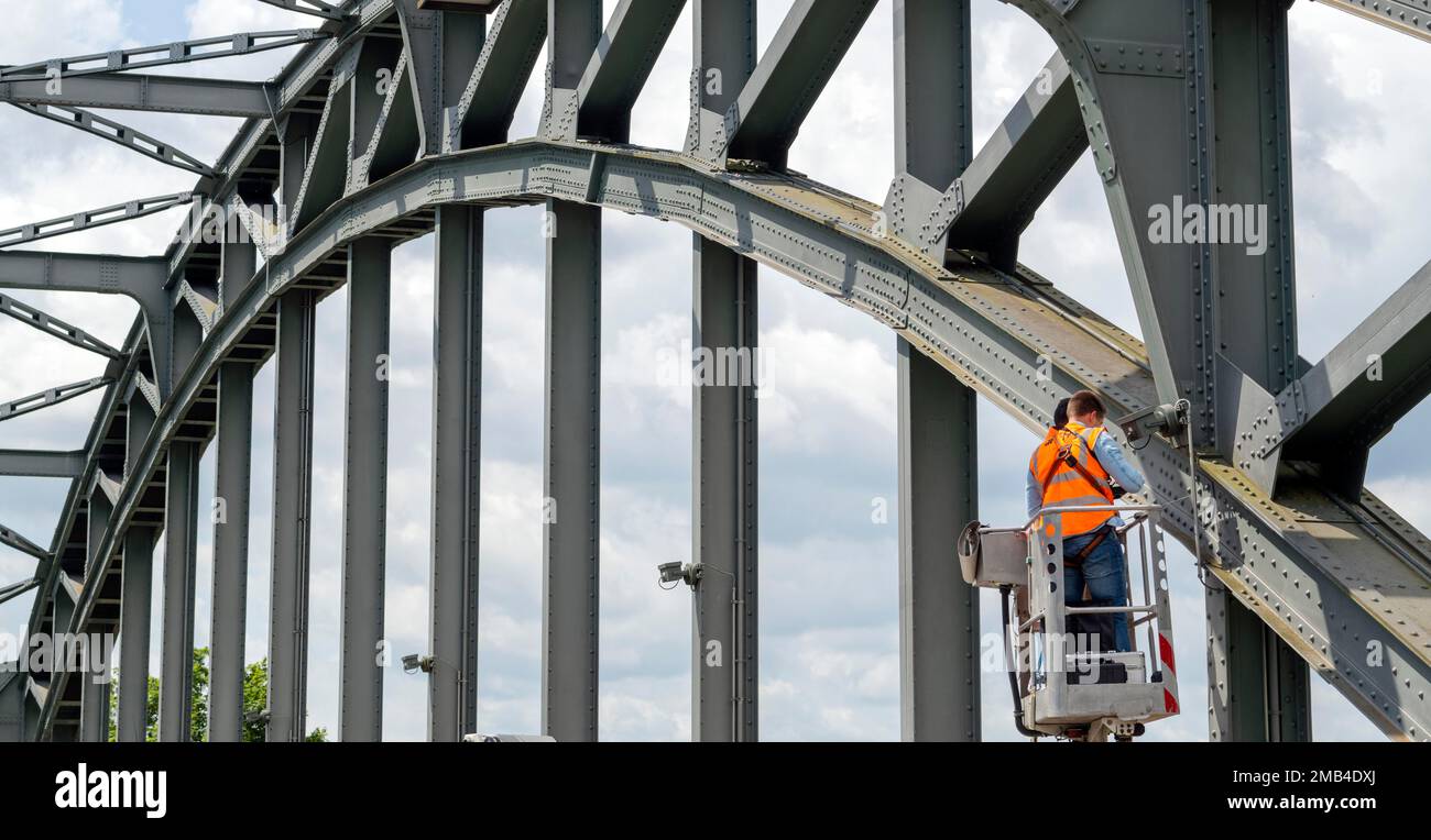 Bridge inspection on the river Stock Photo - Alamy