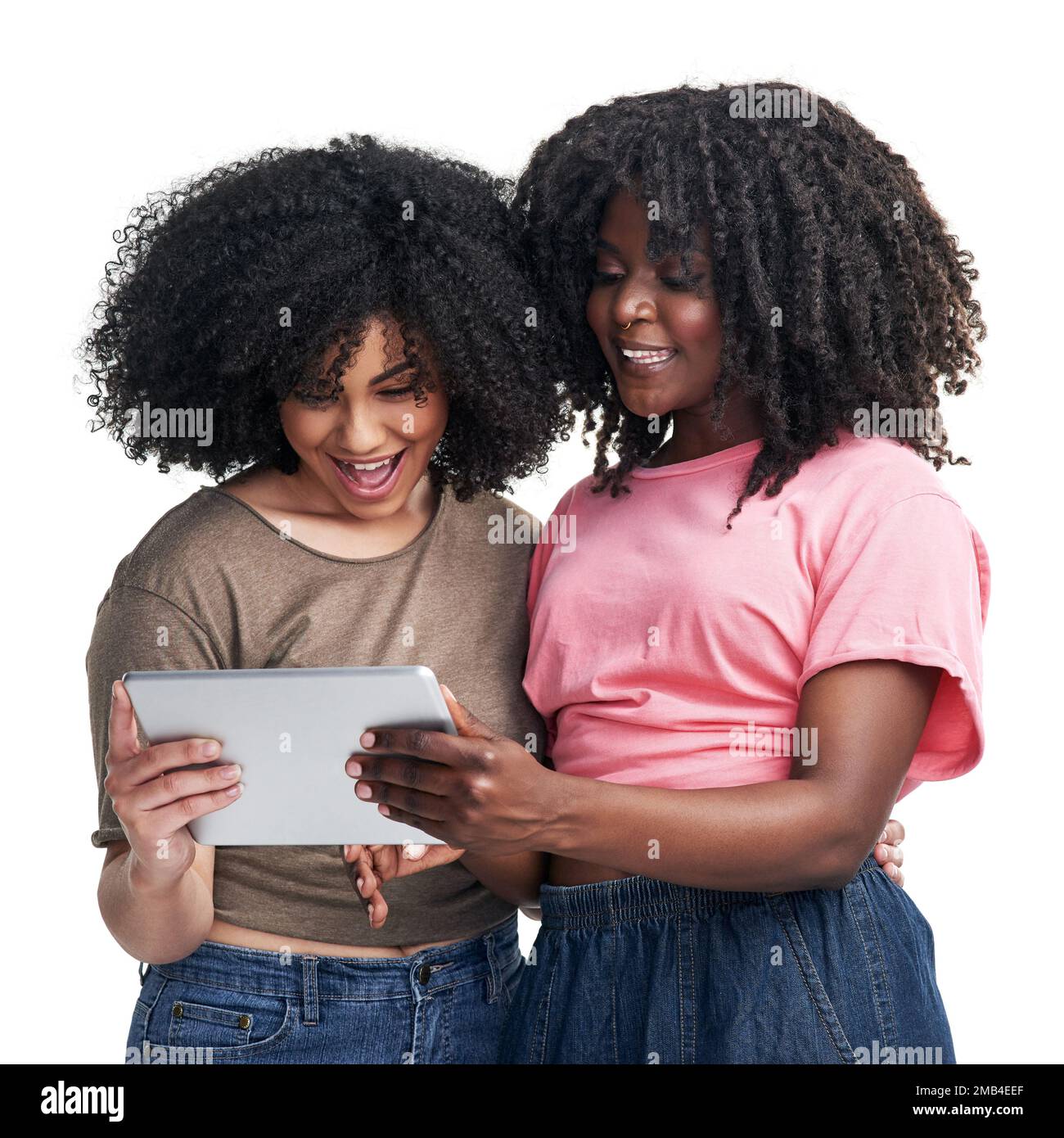 Logged into a buzzing social life. Studio shot of two young women using ...