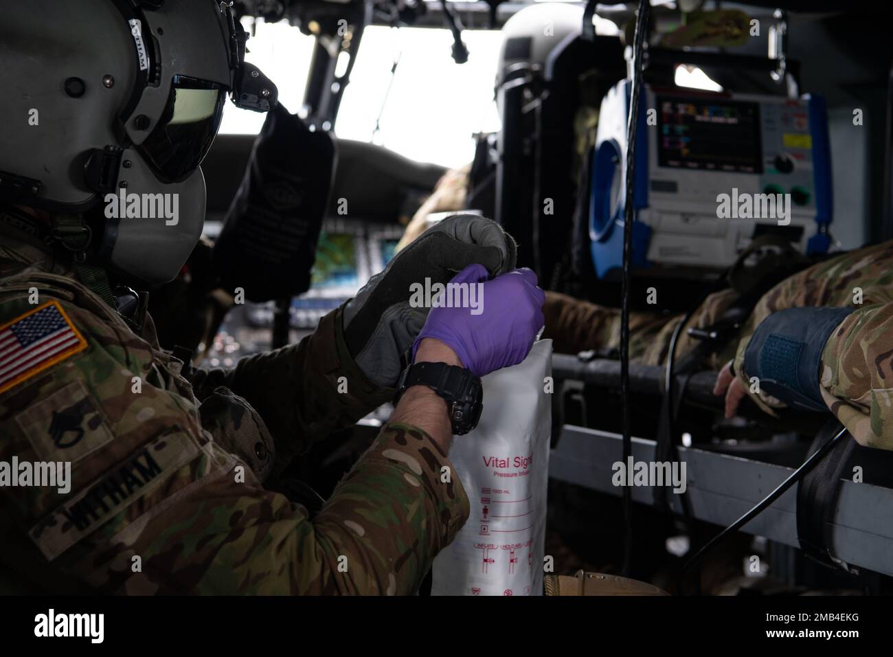 U.S. Army Staff. Sgt. Michael Witham, a flight medic with the 126th ...