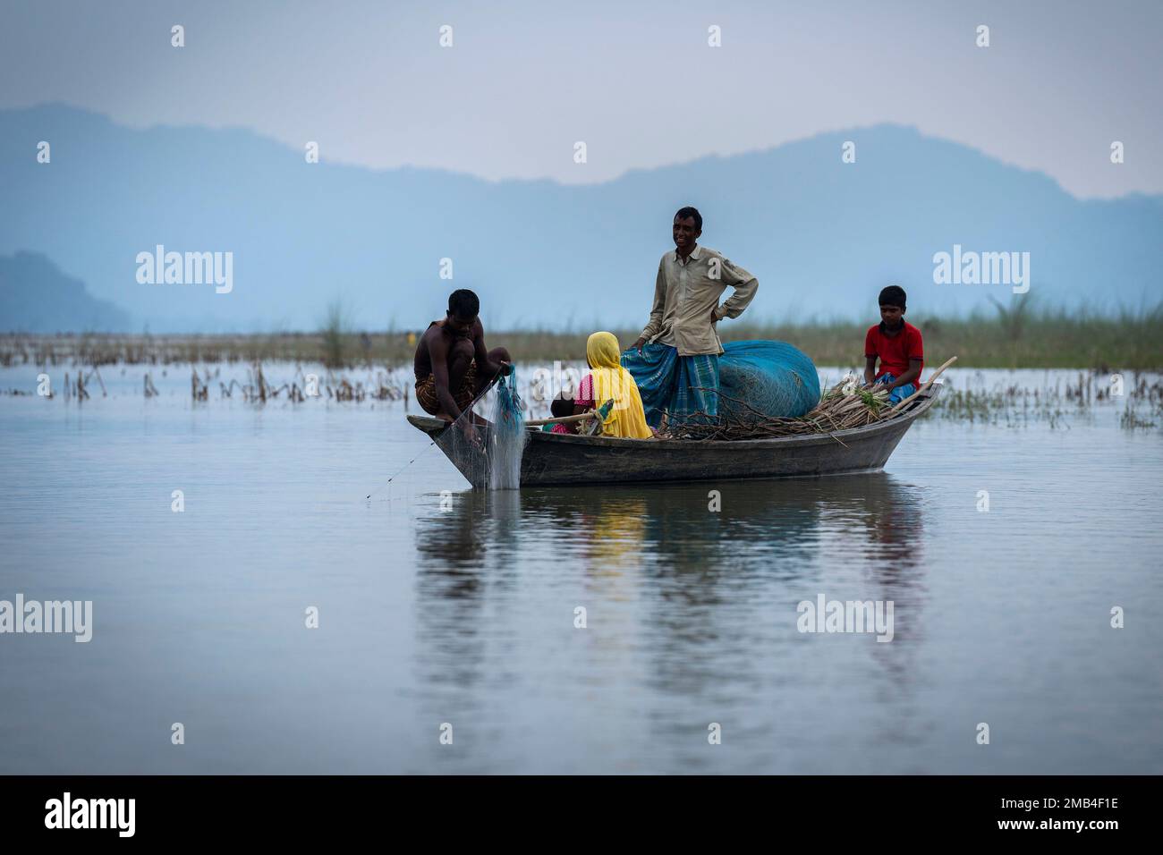 A fisherman catches fish in the river Brahmaputra on the outskirts of ...