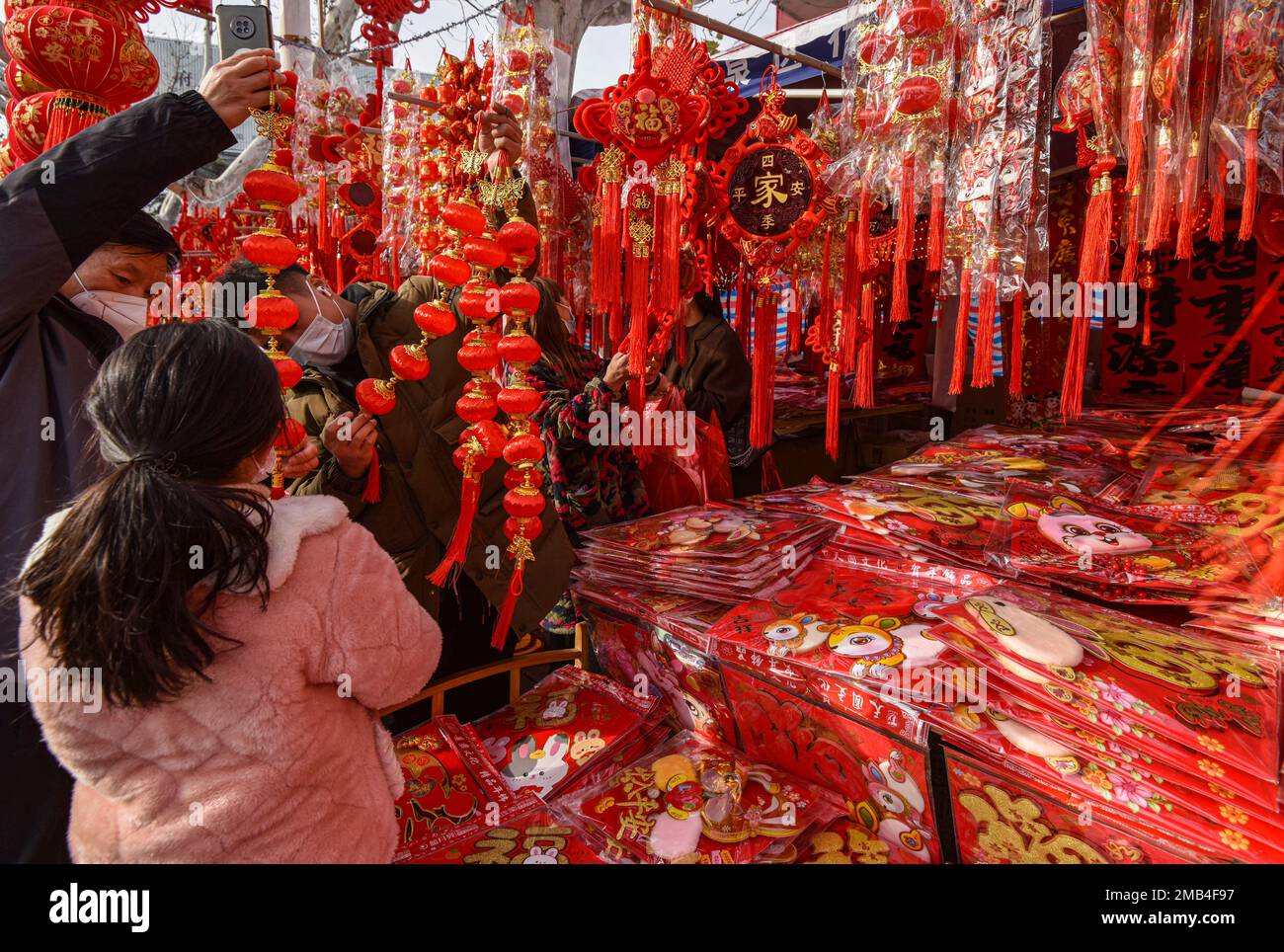 Customers select Spring Festival decorations at a New Year market on ...