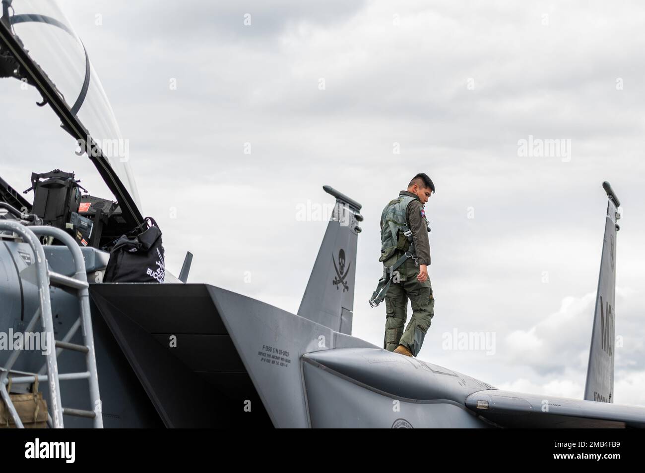 A Republic of Singapore Air Force pilot inspects the exterior of an F ...