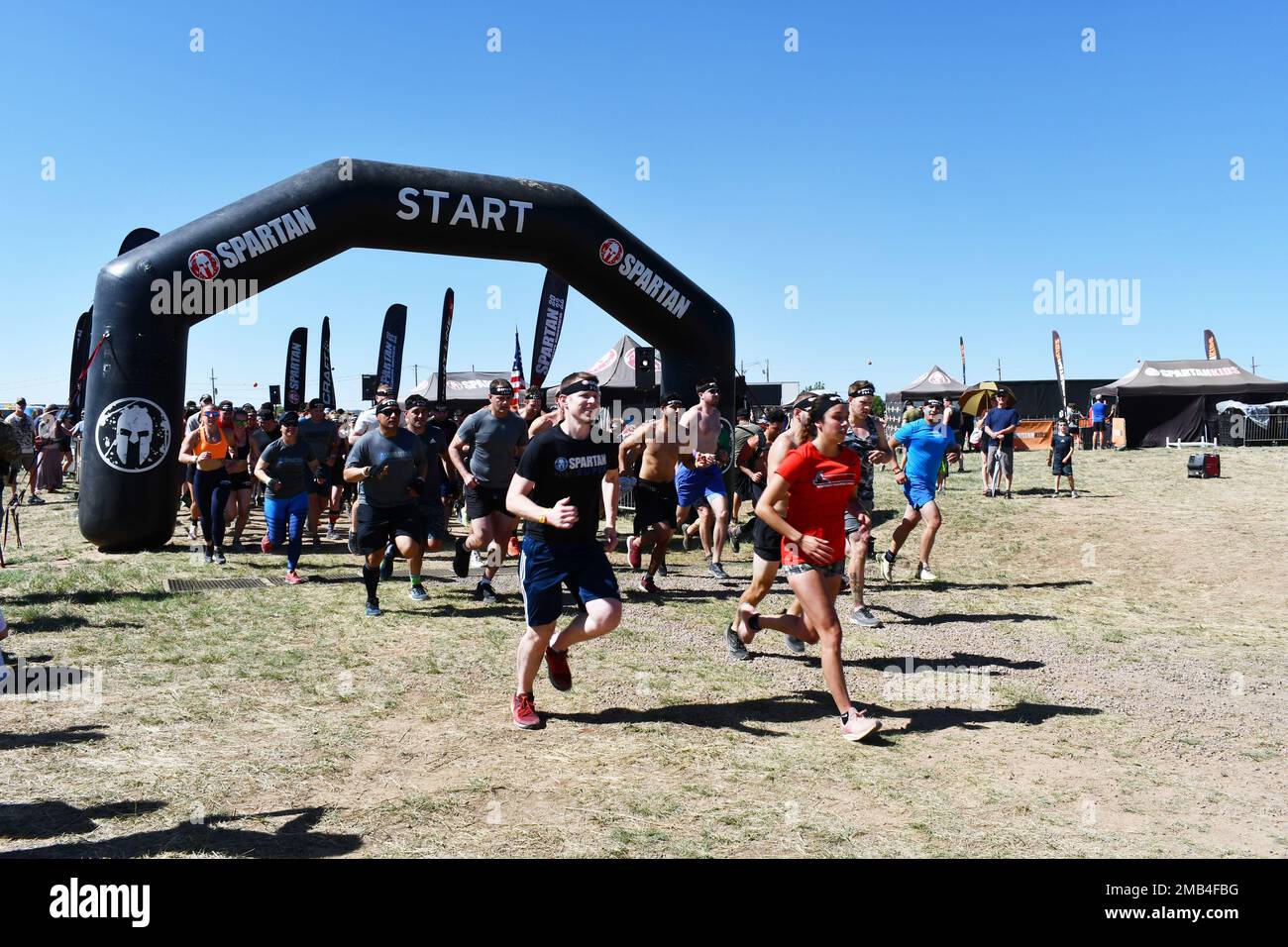 FORT CARSON, Colo. — Runners take off on their heat of the Spartan Race ...