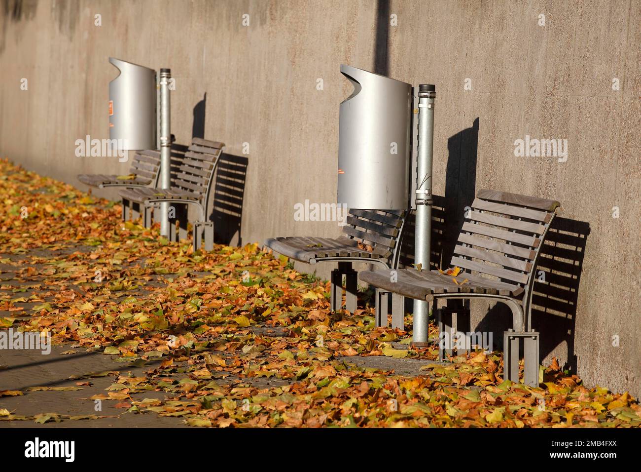 Wooden waste bins and benches with autumn leaves, Germany Stock Photo ...