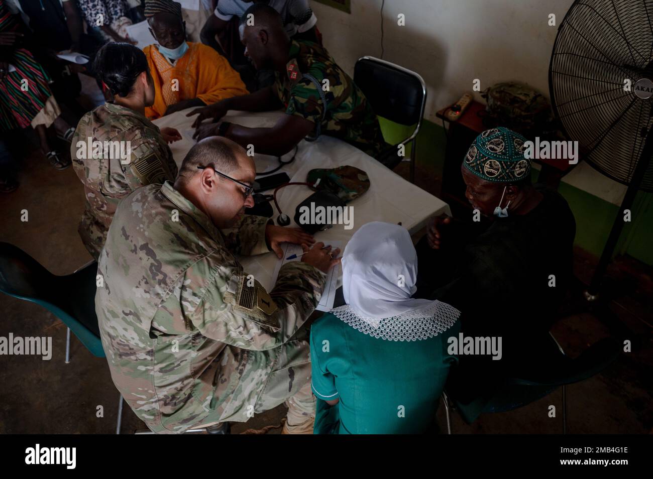 U.S. Army Civil Affairs and Ghanaian Army members treat local civilians ...