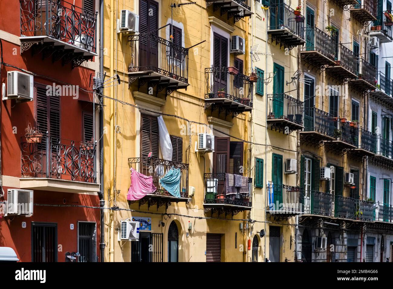 Facade of a residential building in Palermo with balconies and hanging ...