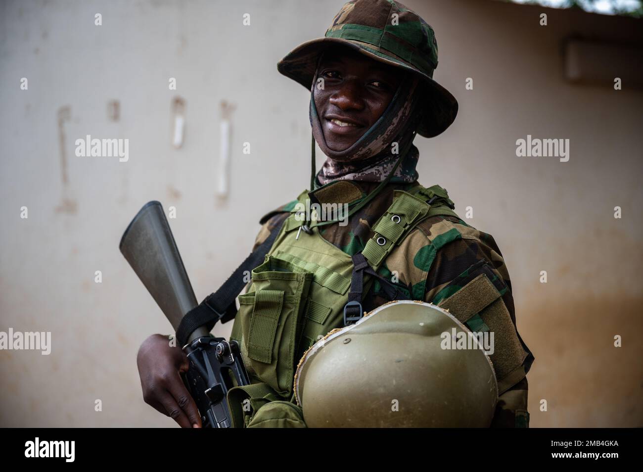 A Ghanaian army solider assist in a medical civic action program ...