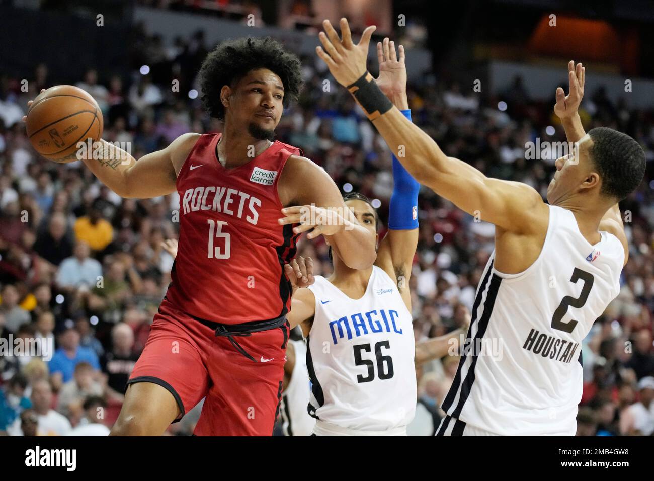 Houston Rockets' Daishen Nix, left, passes around Orlando Magic's Caleb ...