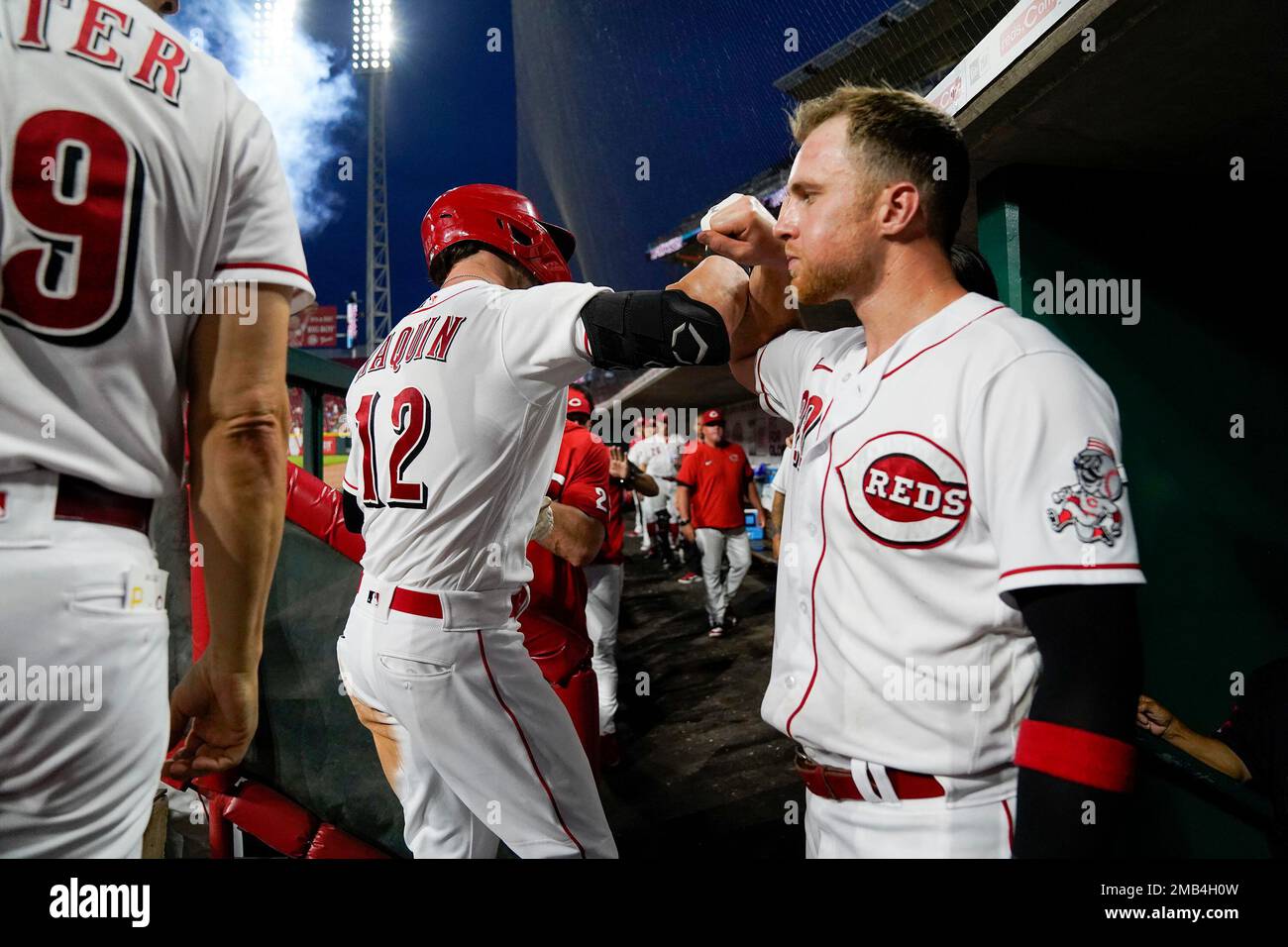 Cincinnati Reds' Tyler Naquin (12) celebrates with Brandon Drury, right ...