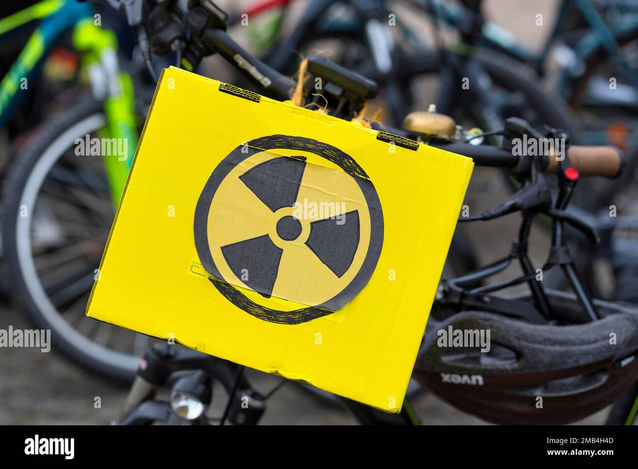 Sign for radioactivity on a yellow cardboard box, package hanging on a ...
