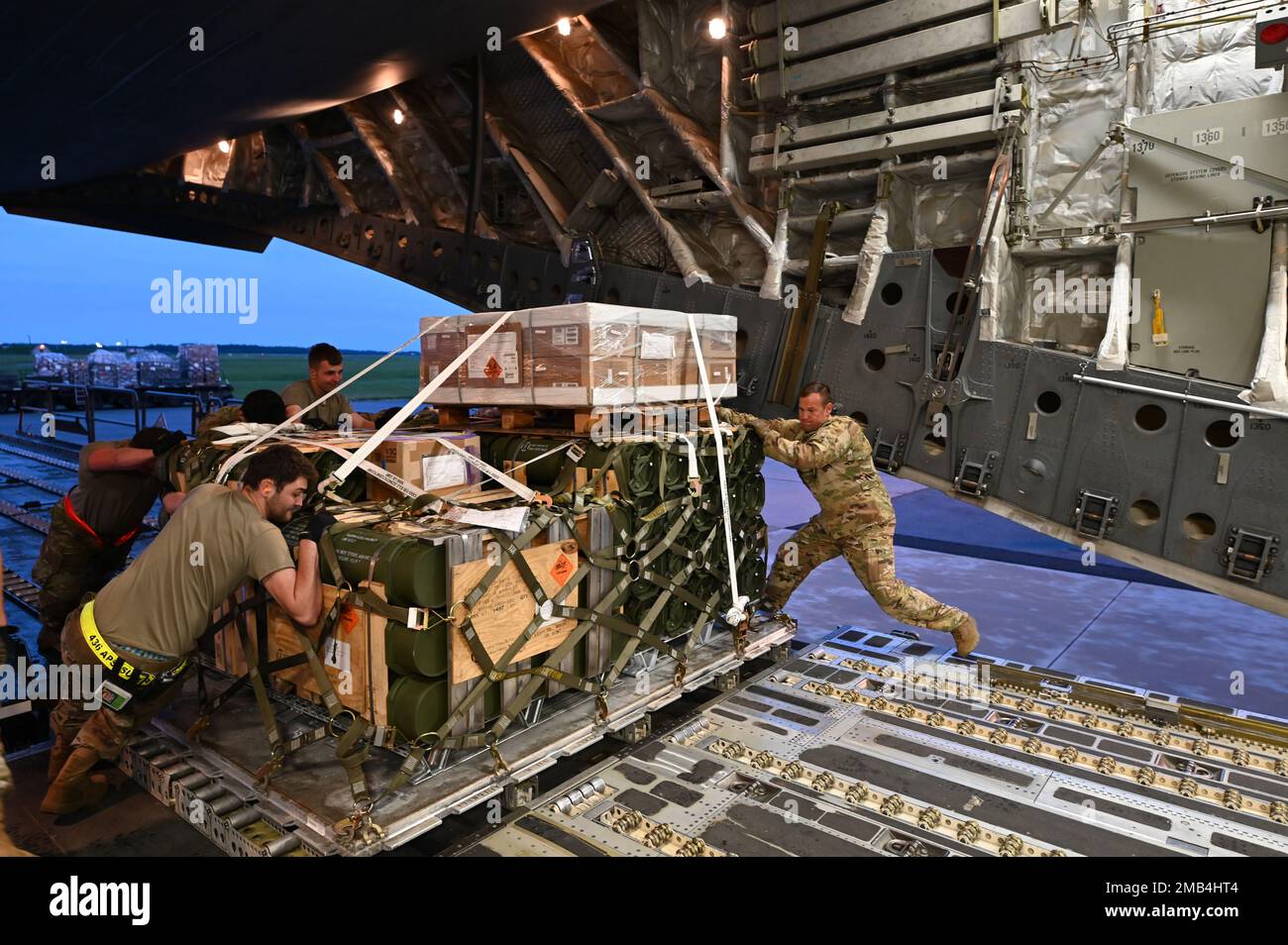 Loadmasters from the 155th Airlift Squadron, load cargo during the ...