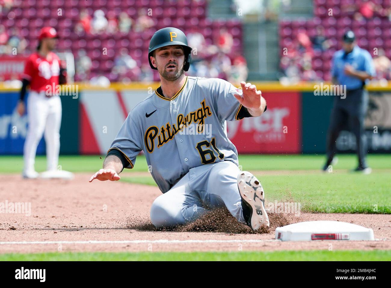 Pittsburgh Pirates' Jason Delay (61) advances to third base on a hit by ...