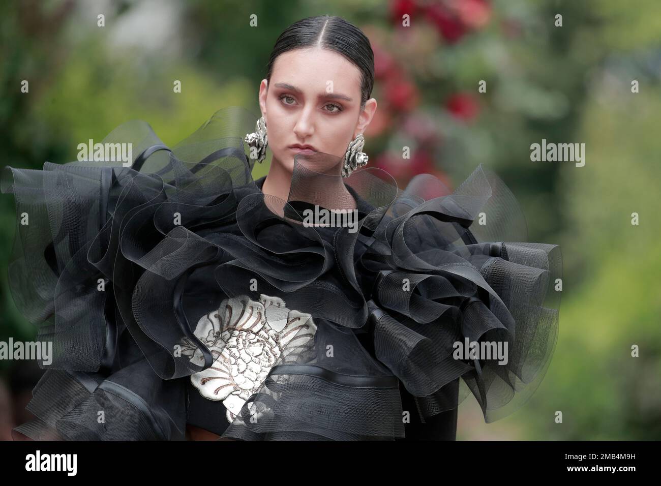 A model wears a creation as part of Juana Martin's Haute Couture Fall ...