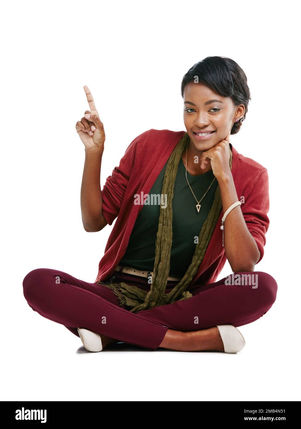 African woman, happy portrait and pointing finger, relax sitting ...