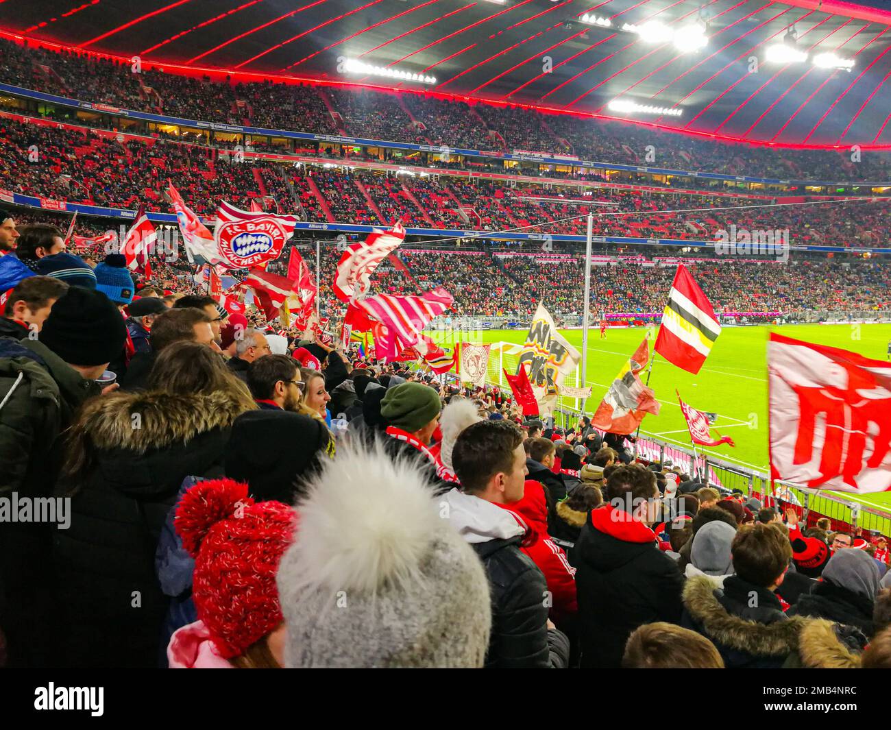 View from the Bayern fan block through waved flags Stock Photo - Alamy