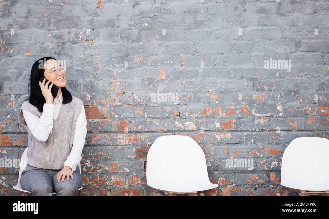 Phone call, chairs and Asian woman in interview waiting room with ...