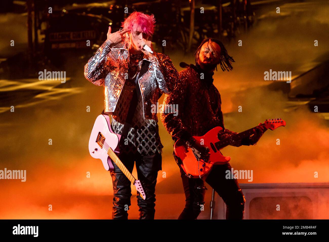 Machine Gun Kelly, left, and guitarist Justin Lyons perform at ...