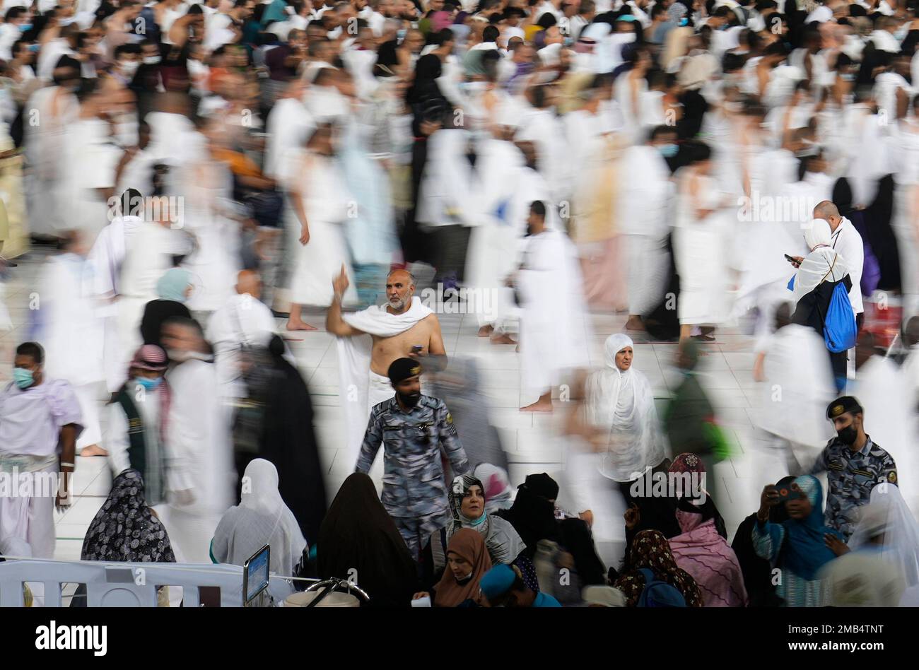 In this photo taken with low shutter speed, Muslim pilgrims ...