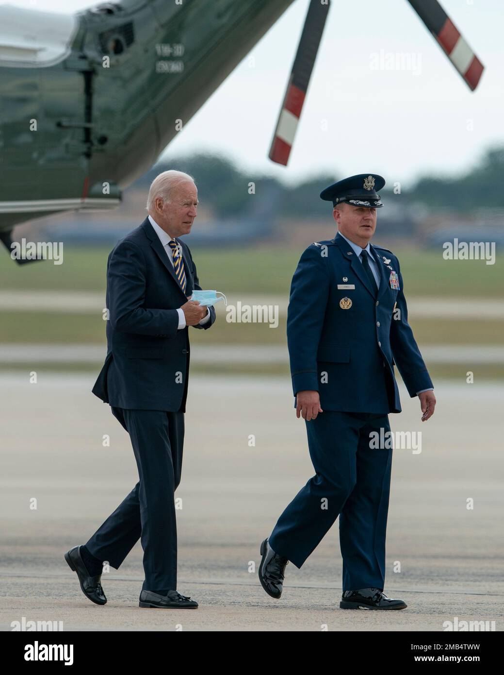President Joe Biden, escorted by Colonel Matthew Jones, Commander, 89th ...