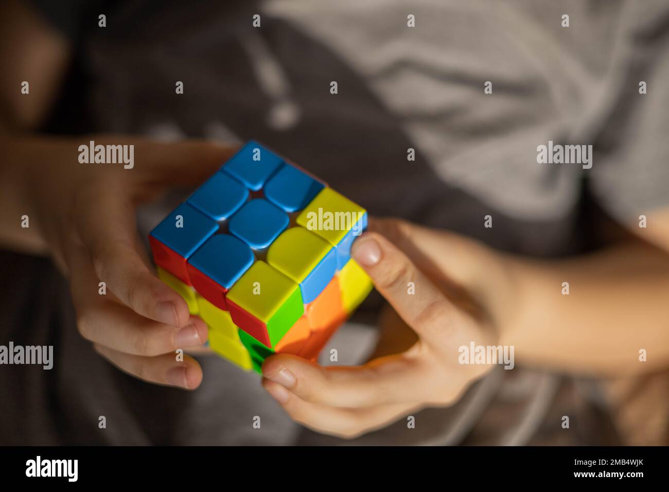 Kid solving rubik's cube hi-res stock photography and images - Alamy