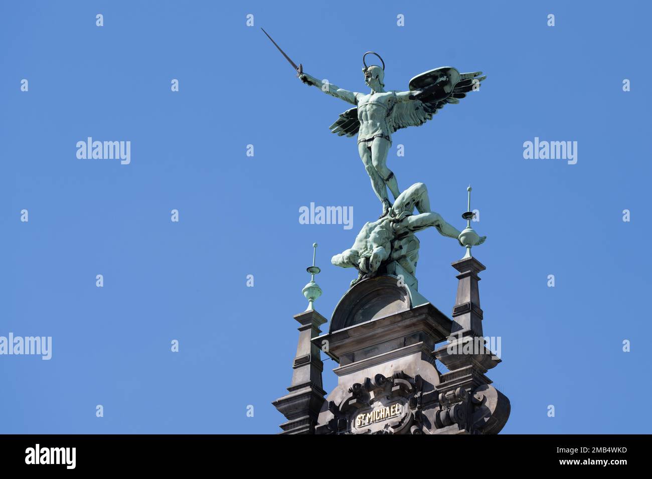 Bronze sculpture on Hamburg City Hall, Archangel St. Michael vanquishes ...