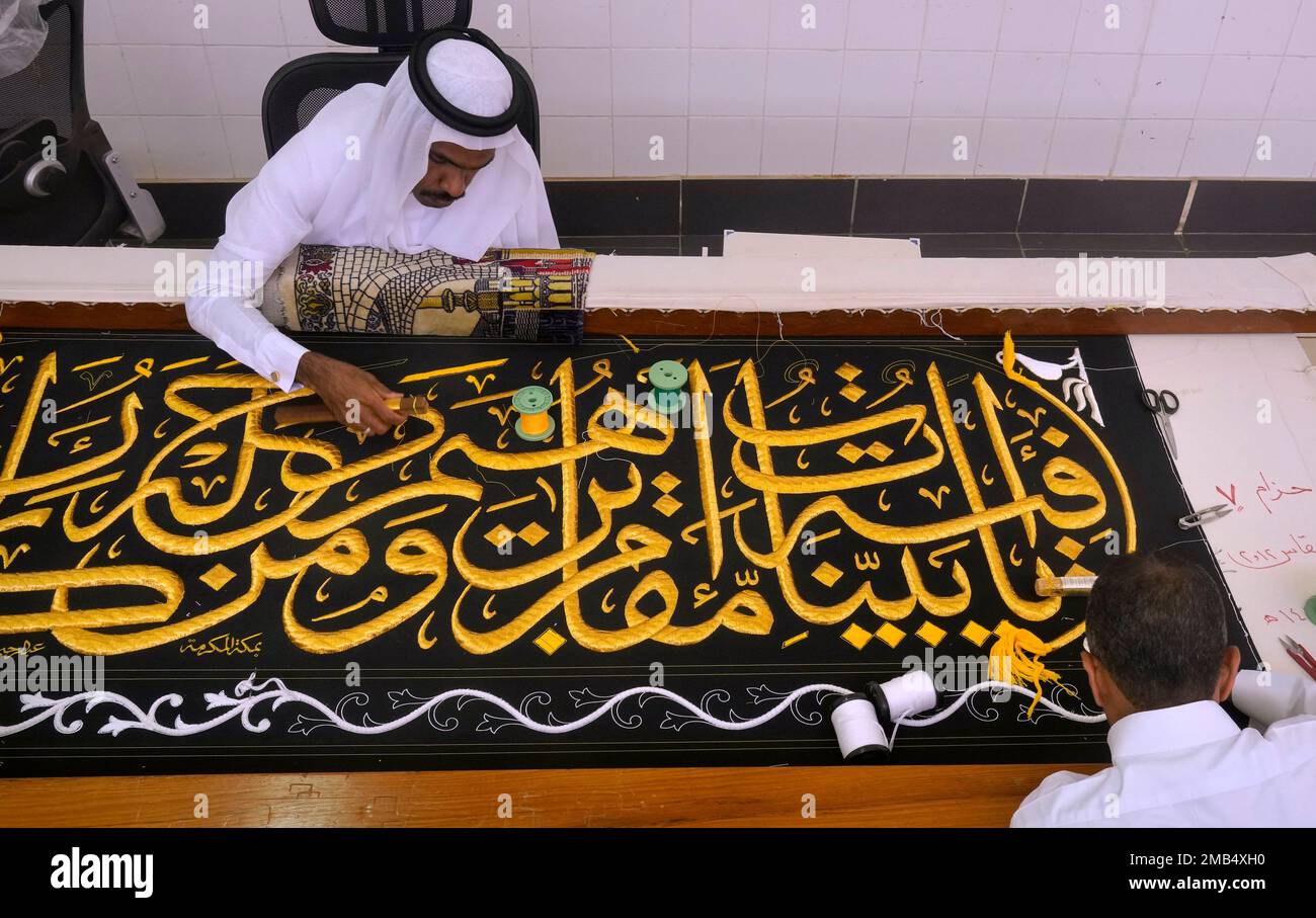 A Saudi worker embroiders Islamic calligraphy, using either pure silver ...