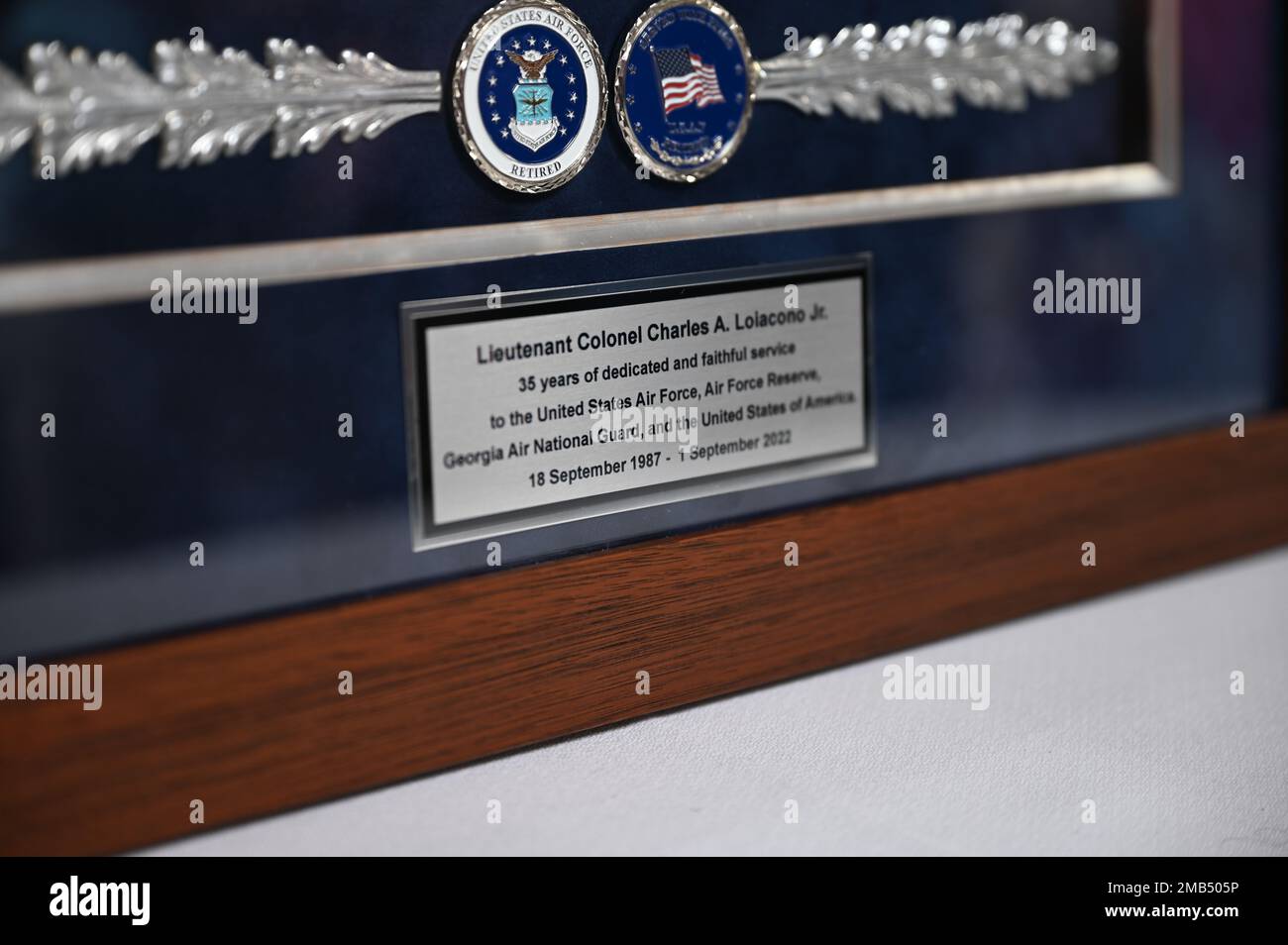 U.S. Air Force Lt. Col. Charles Loiacono was presented a gift during ...