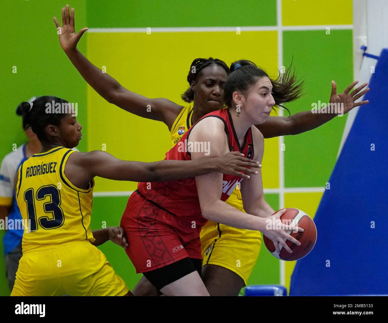 Fernanda Ovalle of Chile, right, drives to the basket as Isabel ...
