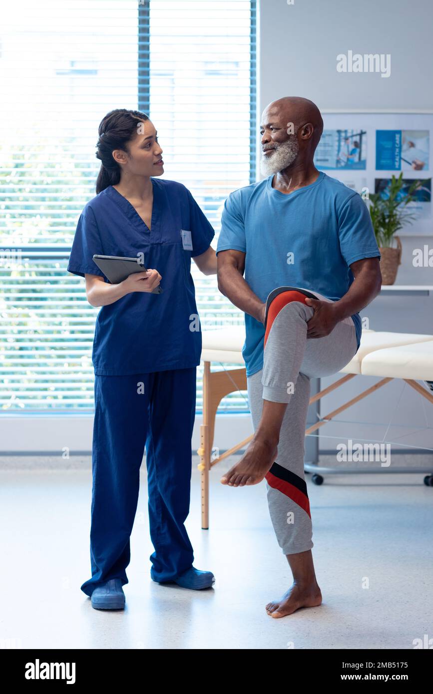 Holding leg hi-res stock photography and images - Alamy