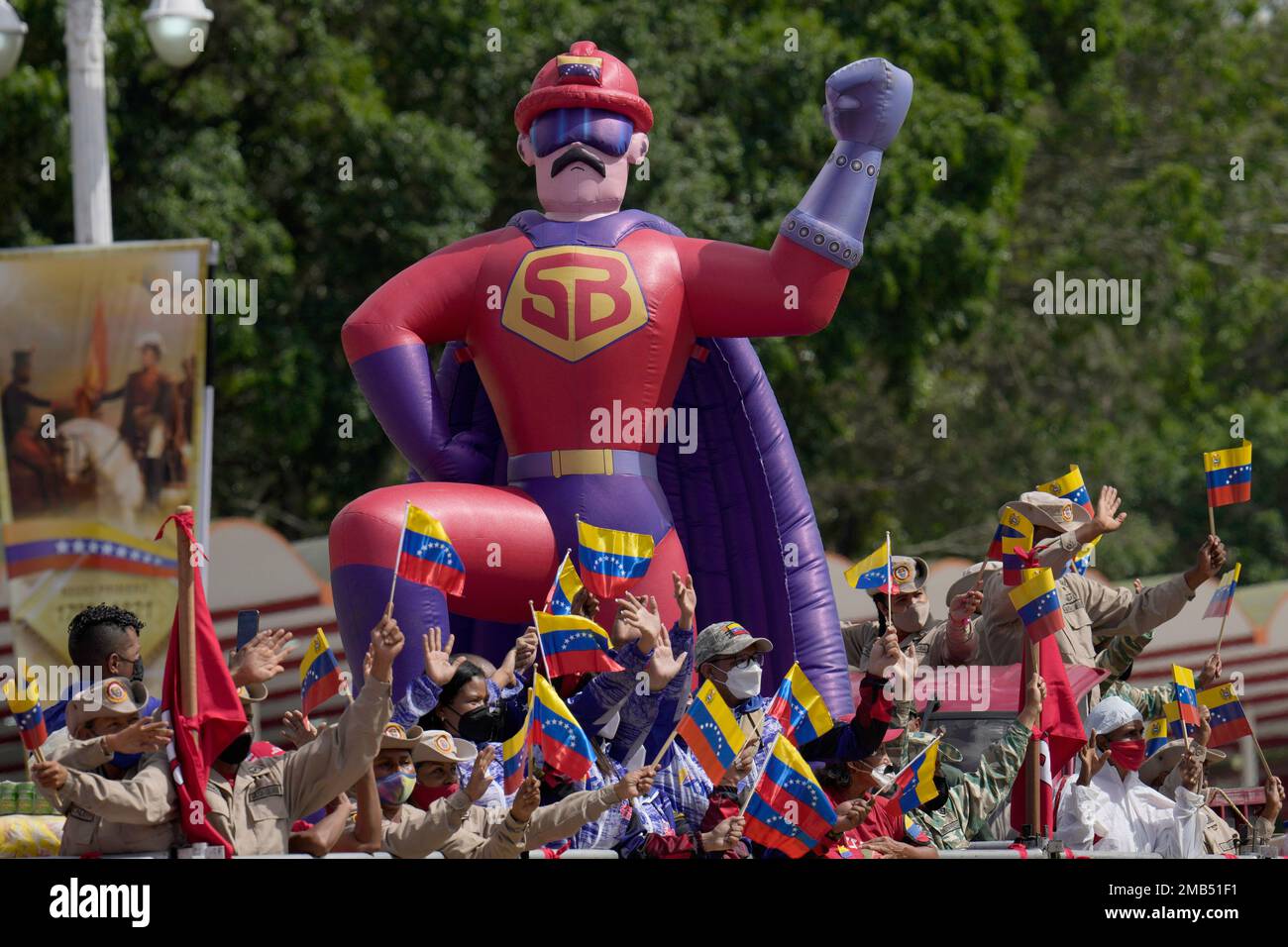 A float with local militia and a blow up doll of the character Super ...